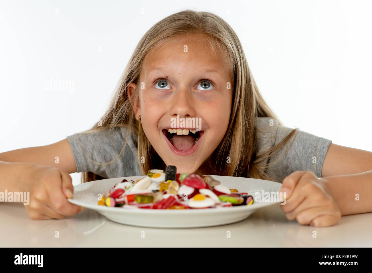 pretty happy sugar high caucasian female child eating dish full of ...