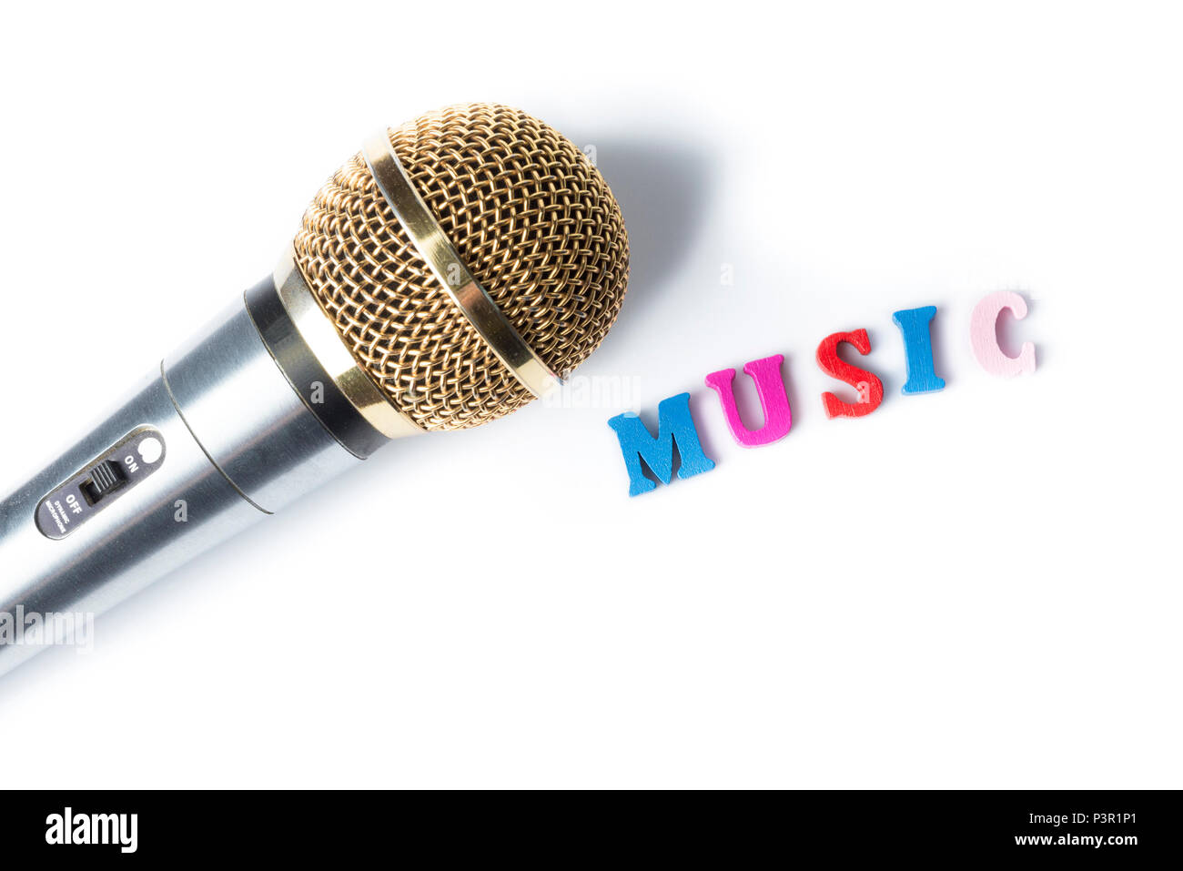 Microphone on a white background with words music of colorful letters ...
