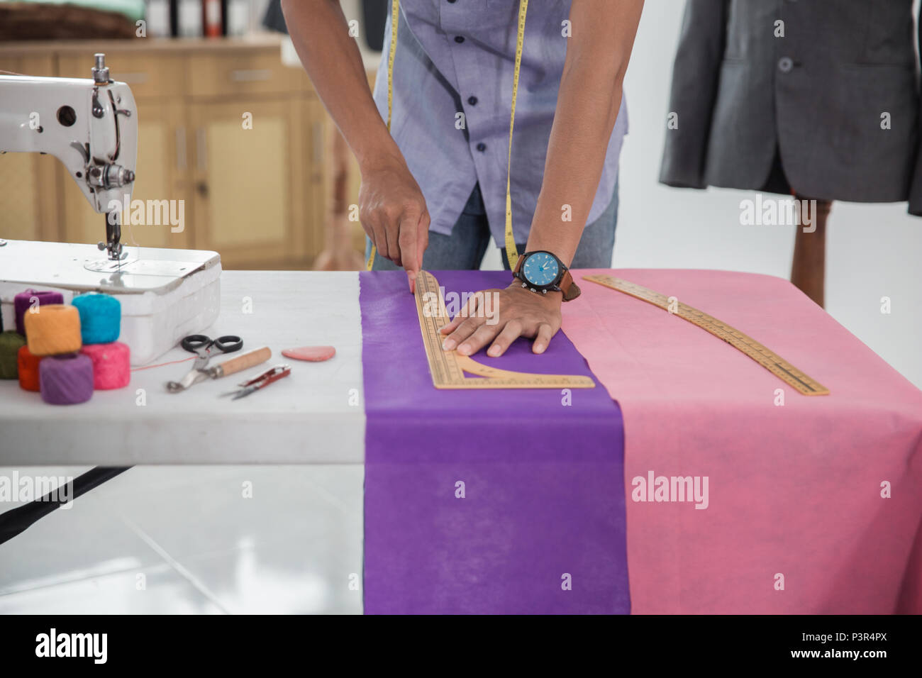 fashion designer make a suit Stock Photo - Alamy