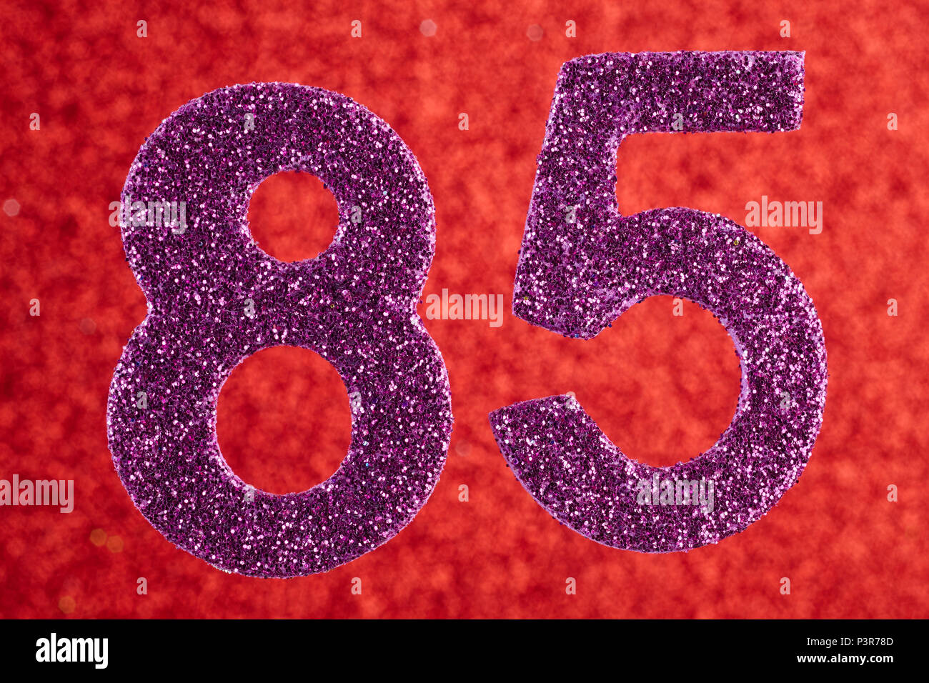Number eighty-five purple color over a red background. Anniversary ...