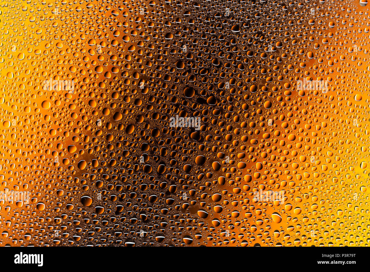 Close up of a water drops on a orange and brown gradient background ...