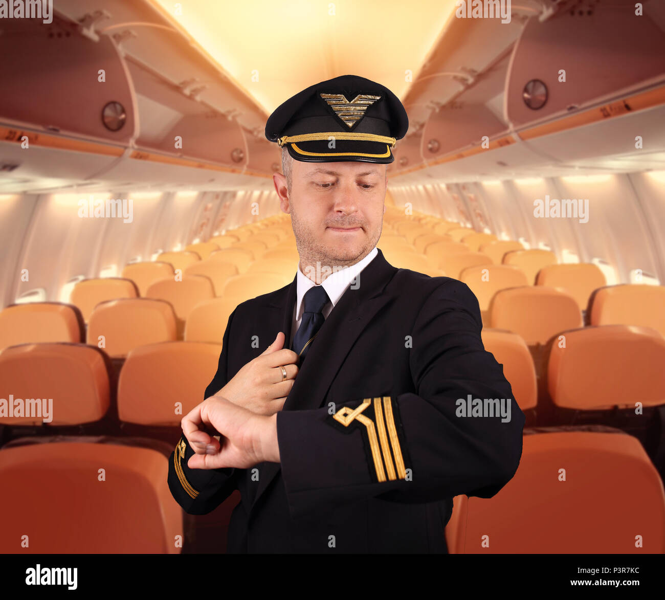 Smiling captain is waiting for passengers Stock Photo - Alamy