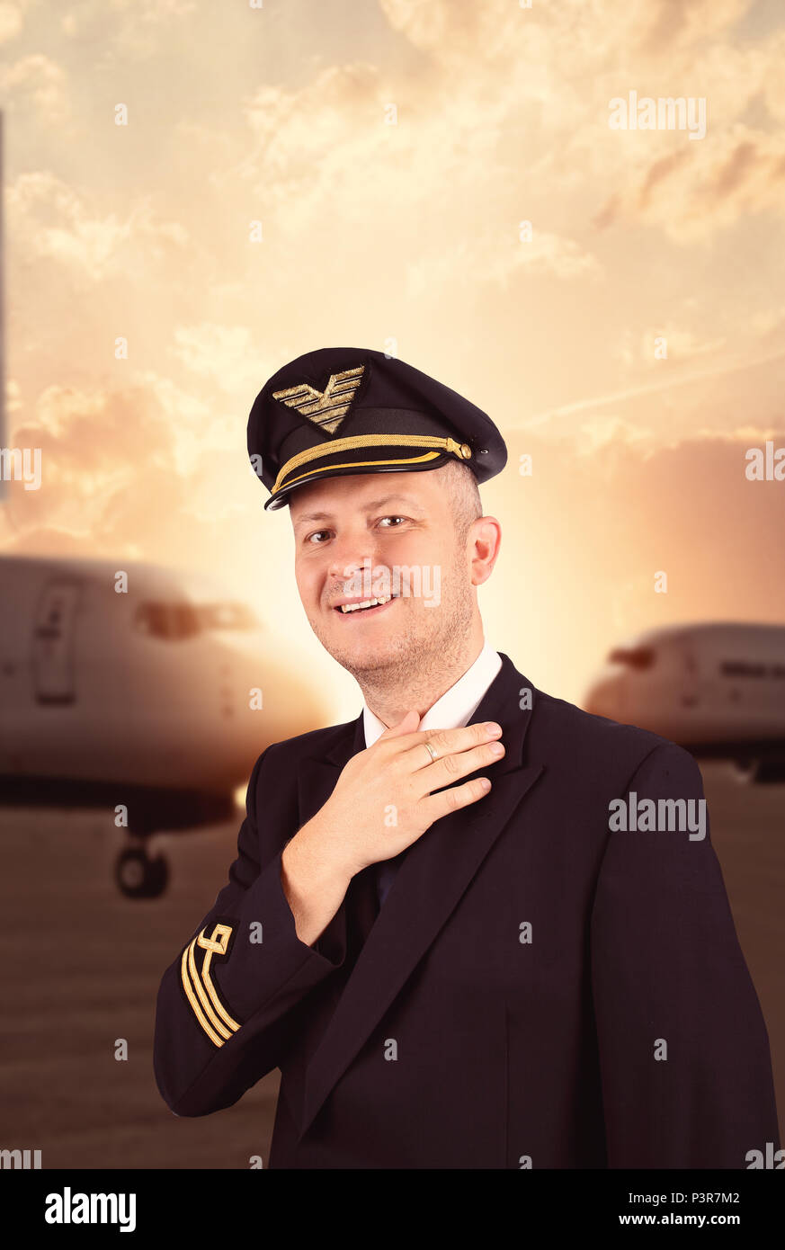 joyful pilot in uniform at the airport Stock Photo - Alamy
