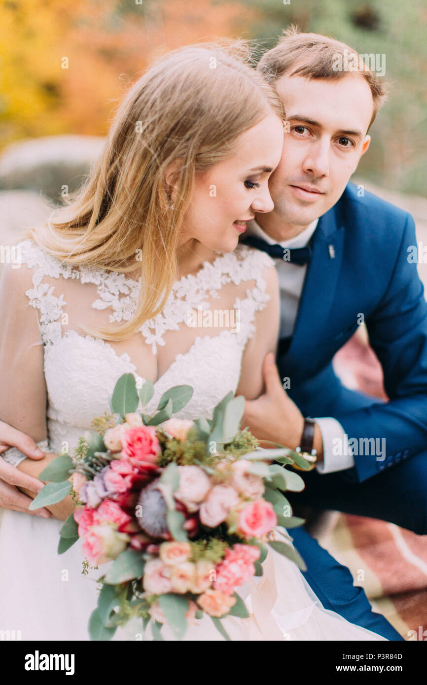 Close-up portrait of the hugging newlyweds. Outdoor portrait Stock ...