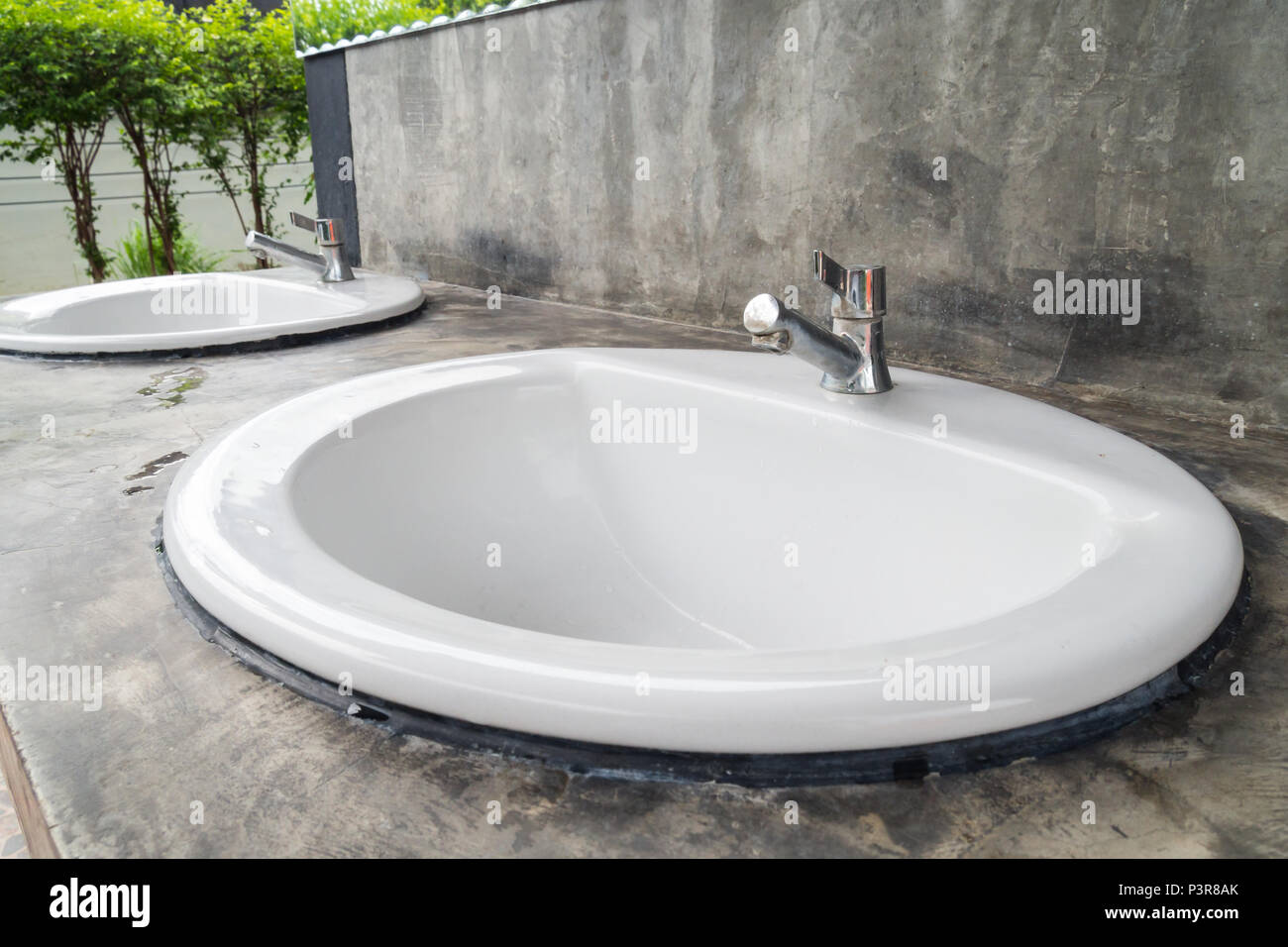 wash bowl , wash basin on cement wall texture Stock Photo - Alamy