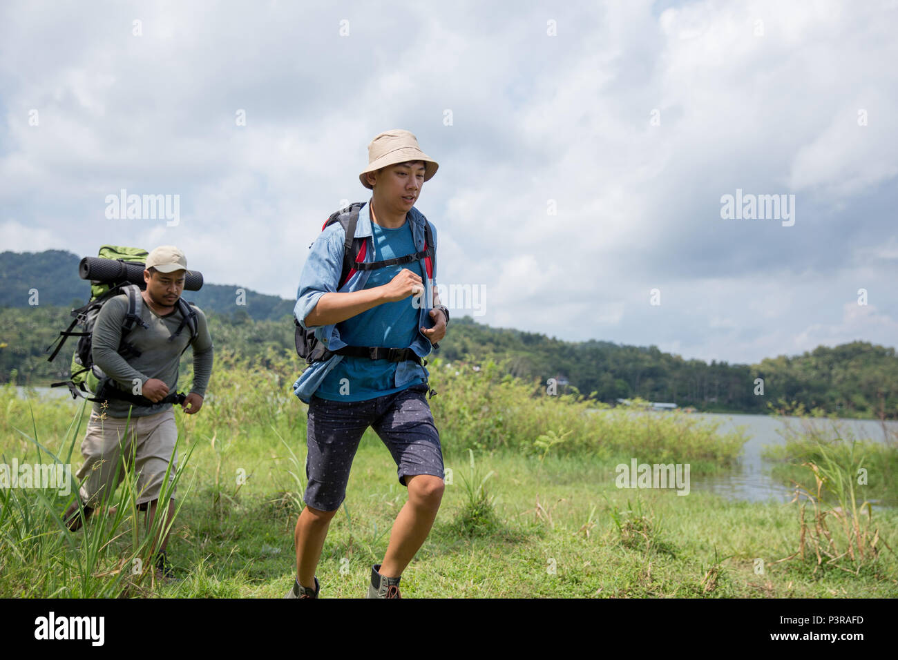 Young adventure hikers trekking lake hi-res stock photography and ...