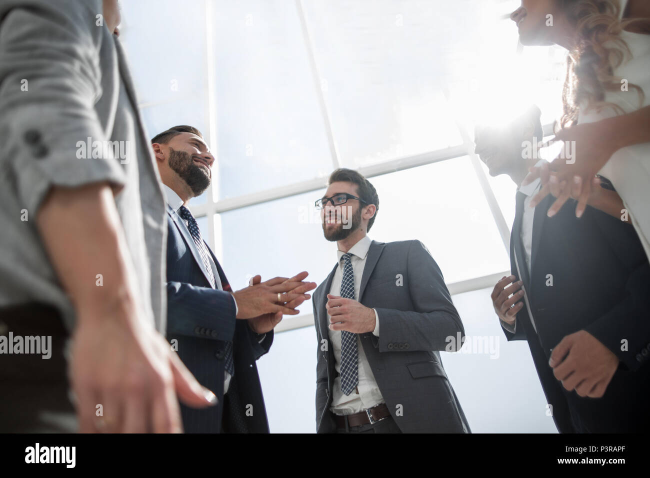 bottom view.group of business people standing in the office Stock Photo ...