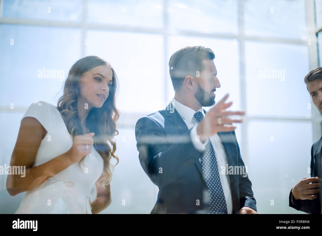 businessman pointing finger at the office window Stock Photo - Alamy
