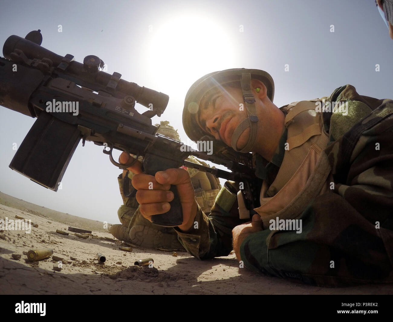 An Iraqi soldier fires an M14 sniper rifle during an advanced ...