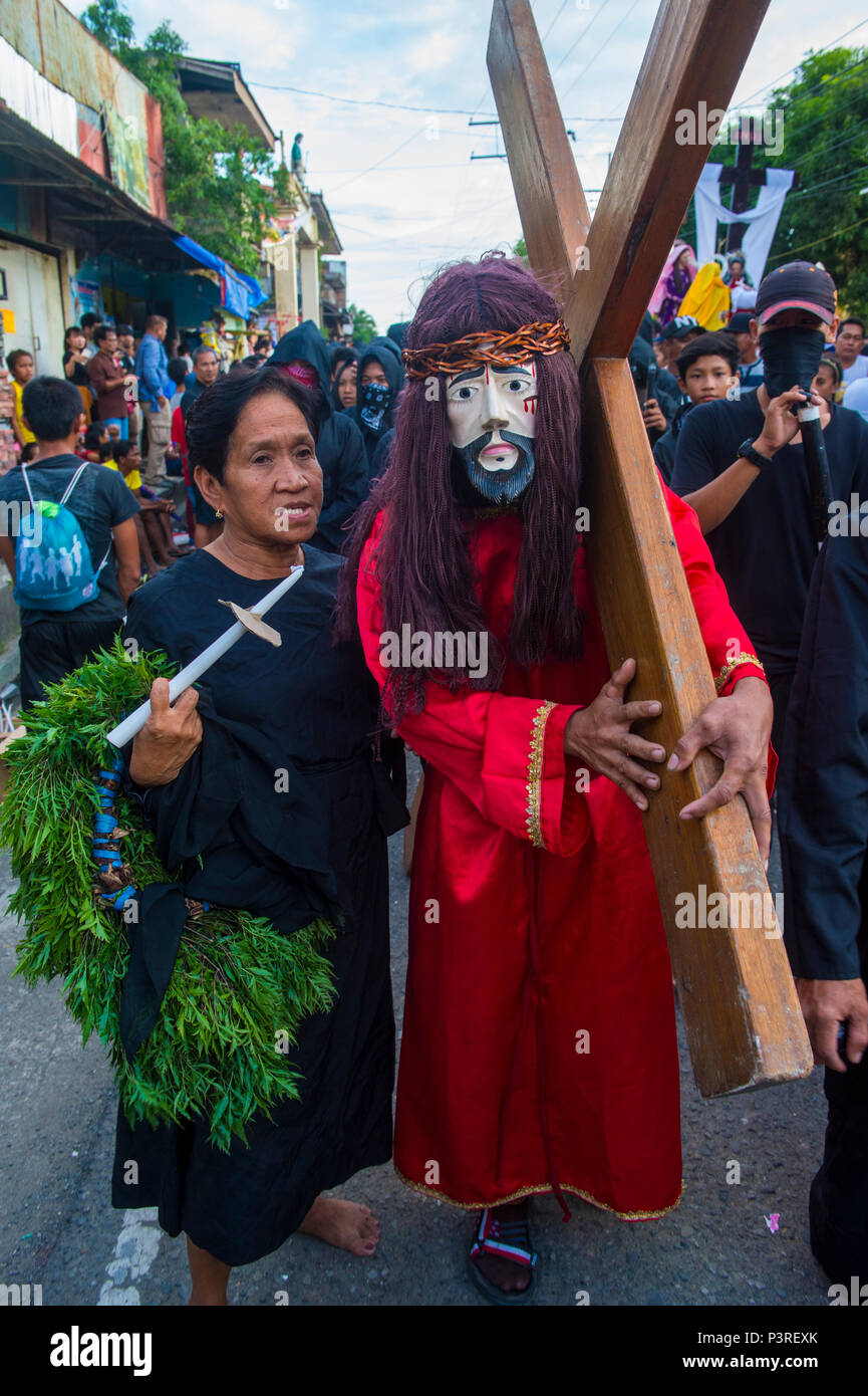 Participants in a Good Friday procession in Gasan, Marinduque Island ...