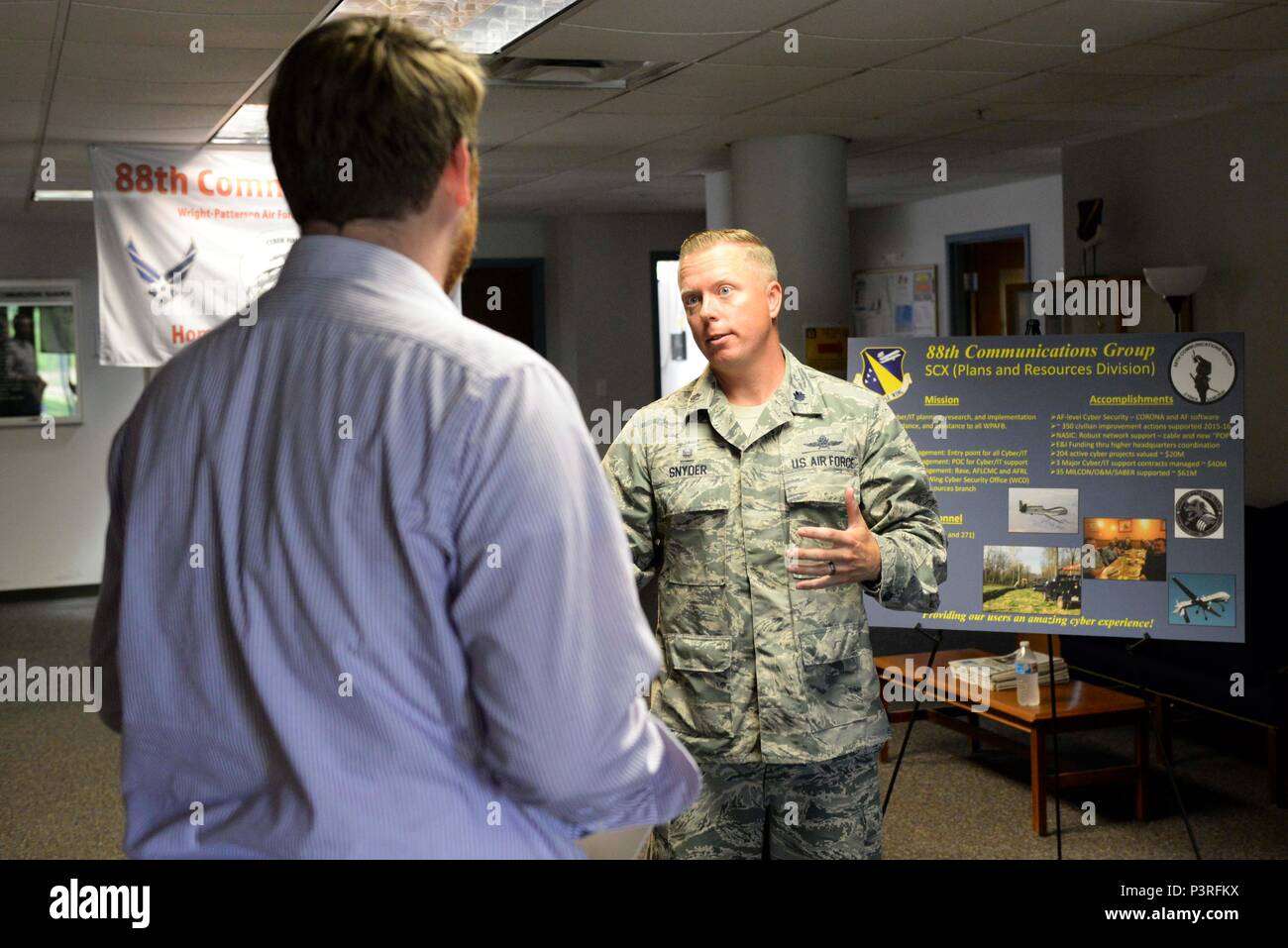 Lt. Col. Brian Snyder, 88th Communications Squadron commander, briefs ...