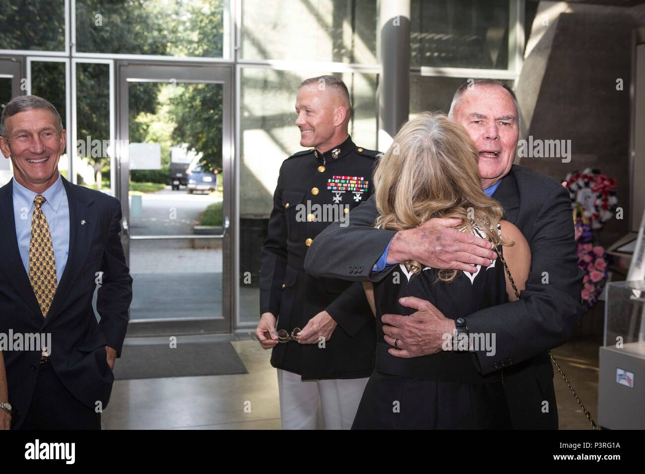 Retired U.S. Marine Corps Lt. Col. Jack Mathews greets guests during ...