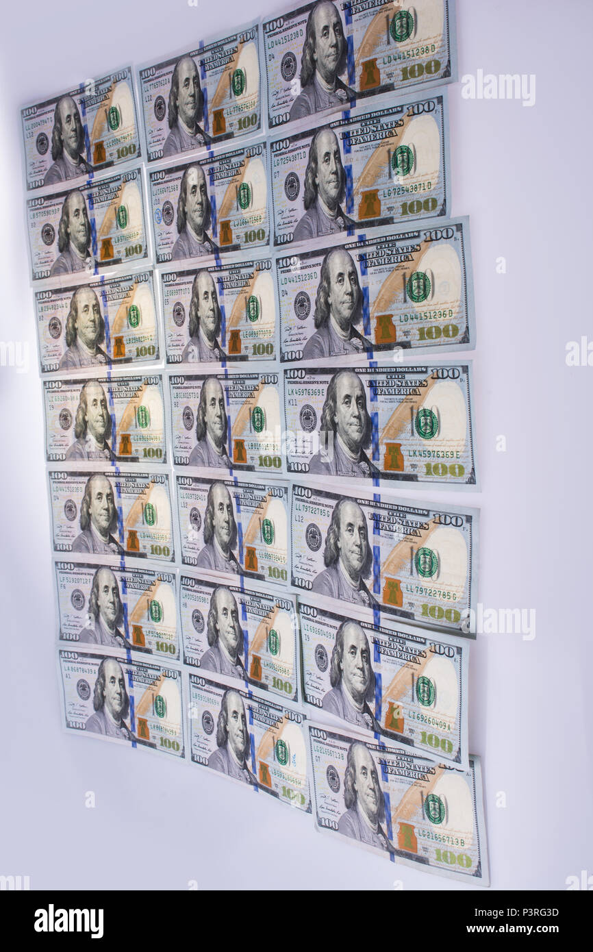 American 100 dollar banknotes made of paper placed on white background ...