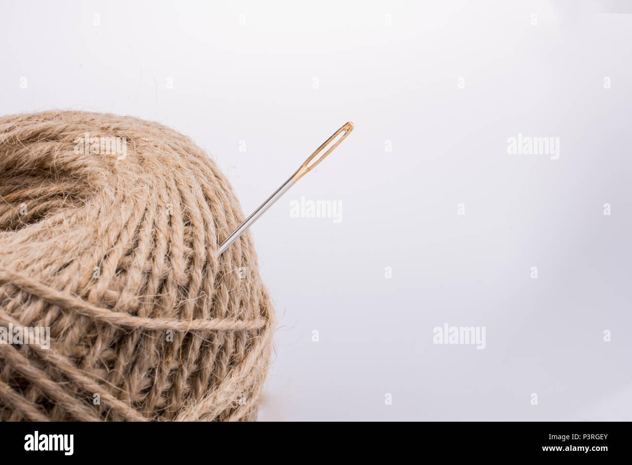 Needle on the spools of thread isolated on white background Stock Photo ...