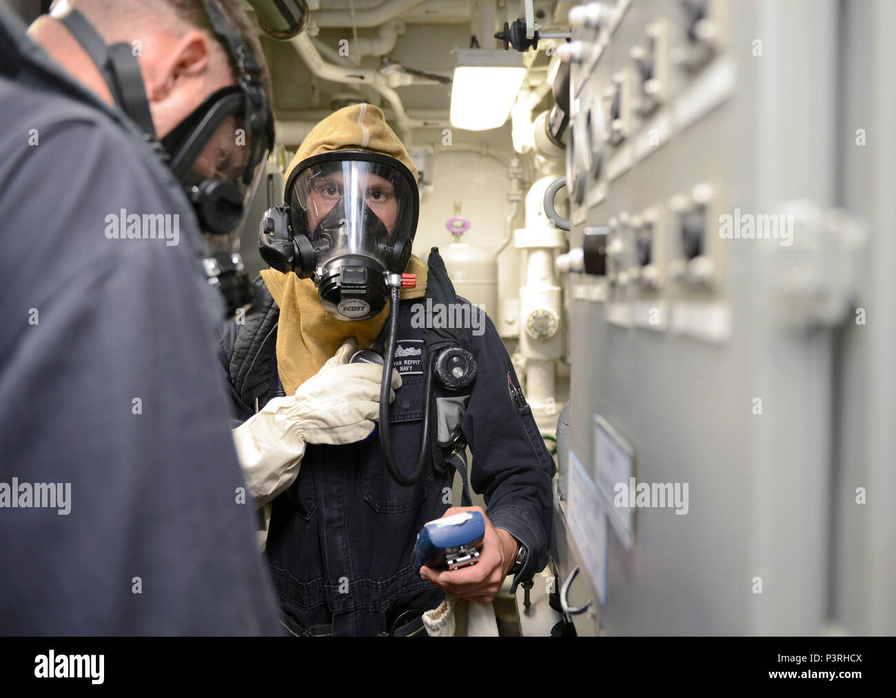 Damage Controlmen aboard USS Momsen (DDG-92) use radios during a damage ...