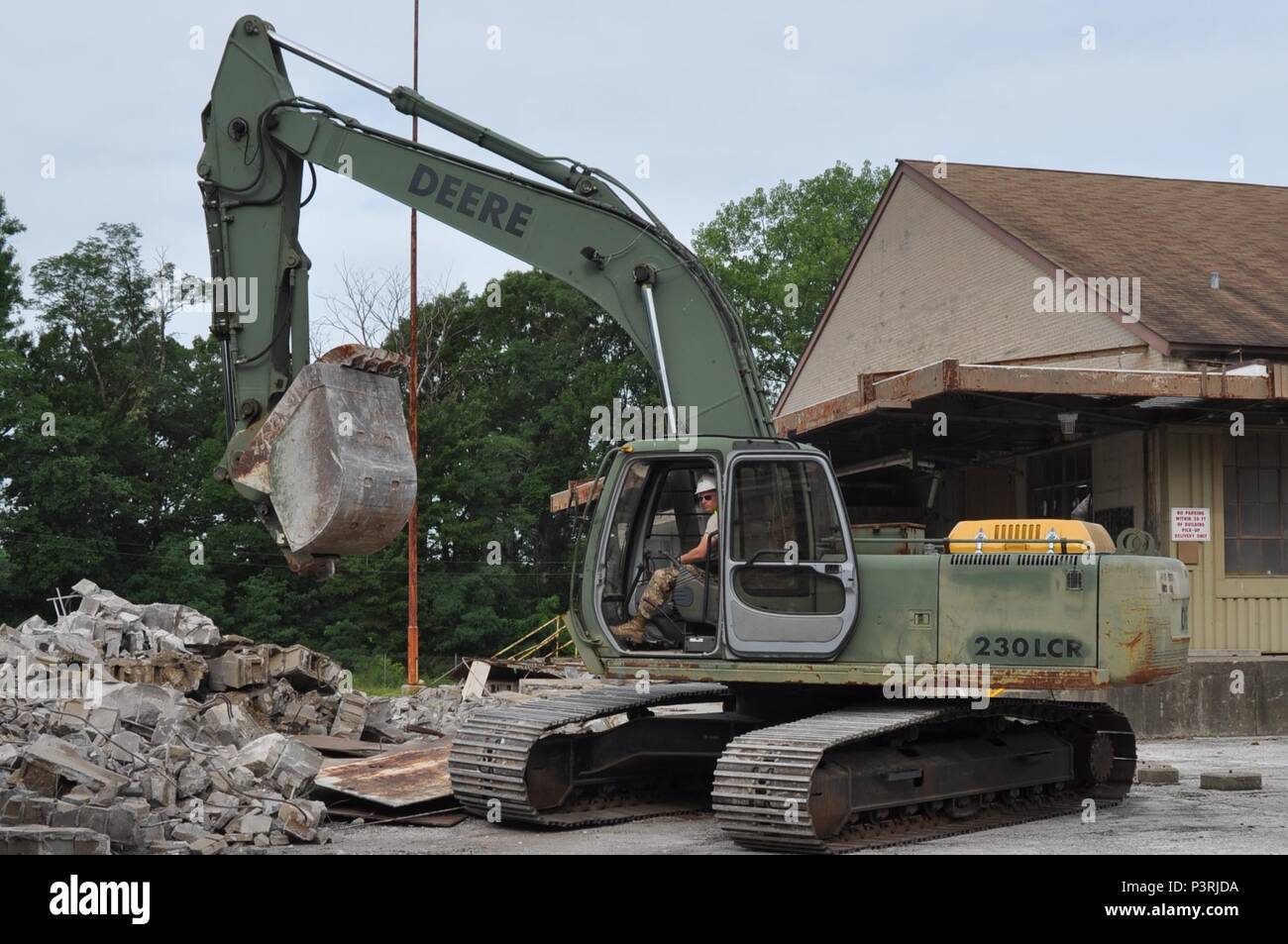 Sgt. Alex Park of the 983rd Engineering Battalion operates equipment to ...