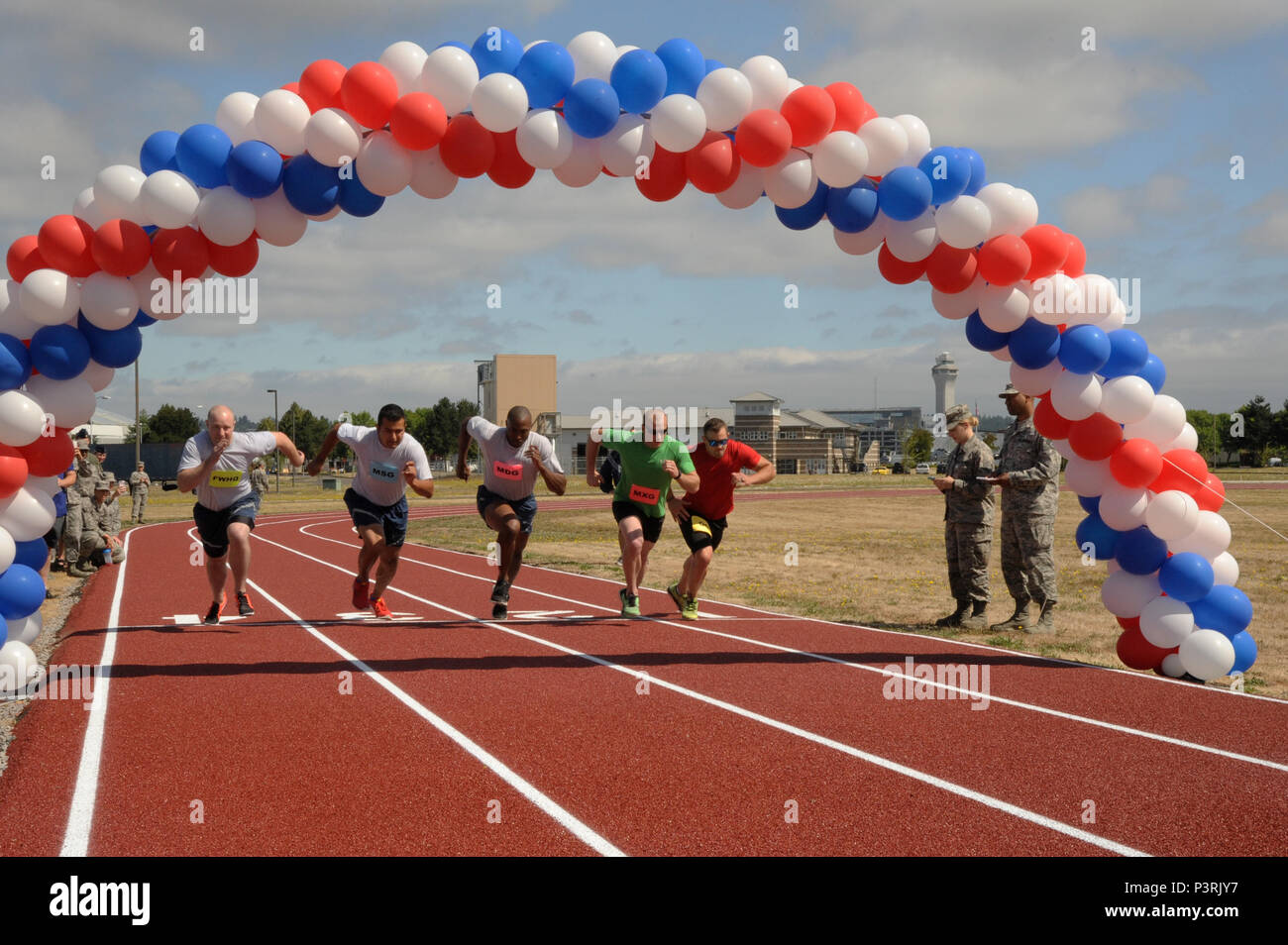 Airmen from the 142nd Fighter Wing take off with the starting line at ...