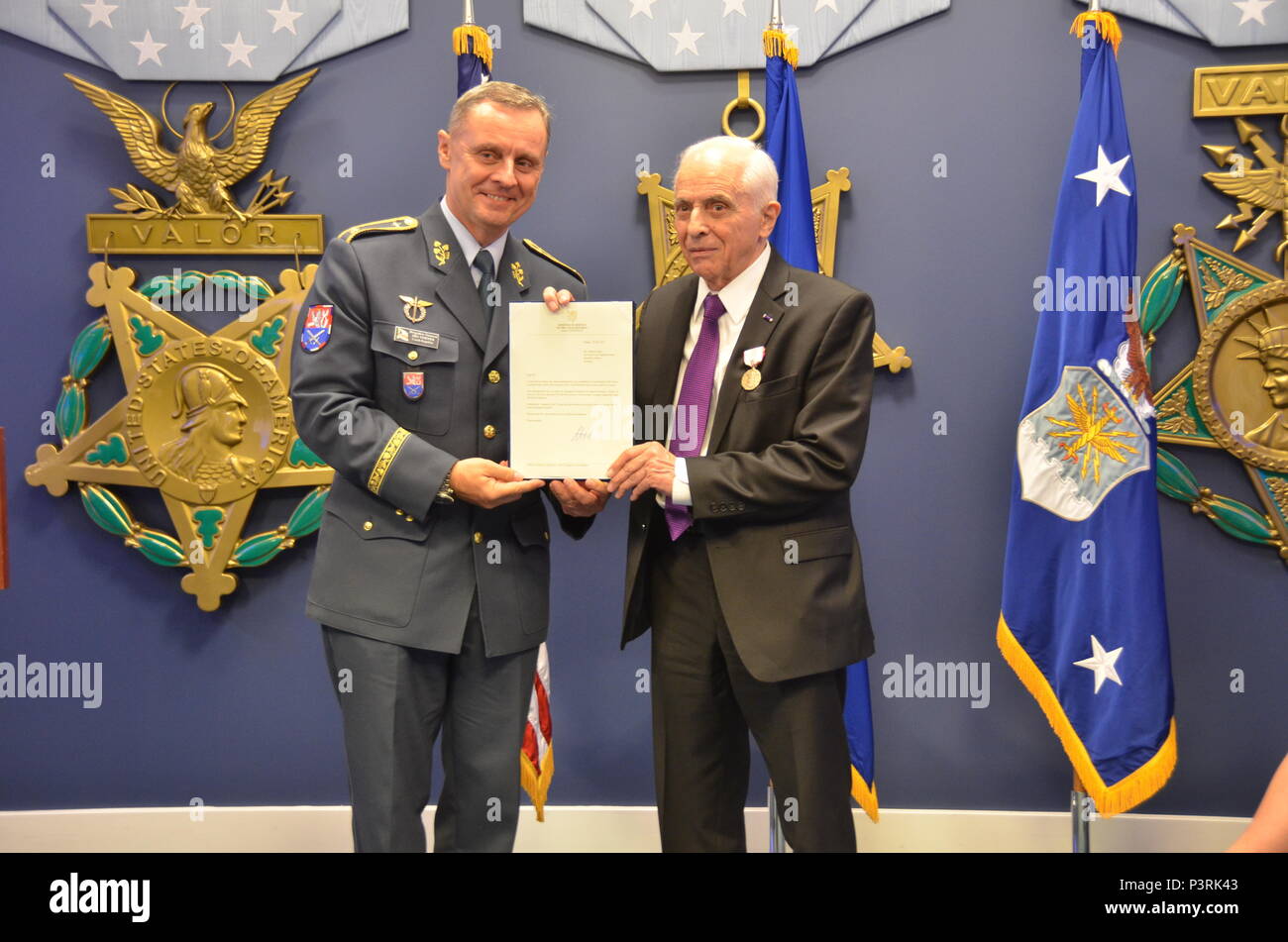 Brig. Gen. Jiri Verner of the Czech Republic congratulates Anthony Duno ...