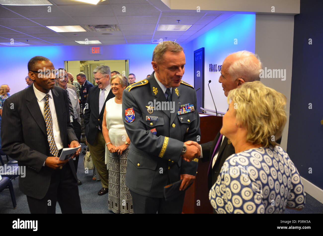 Brig. Gen. Jiri Verner of the Czech Republic congratulates Anthony Duno ...