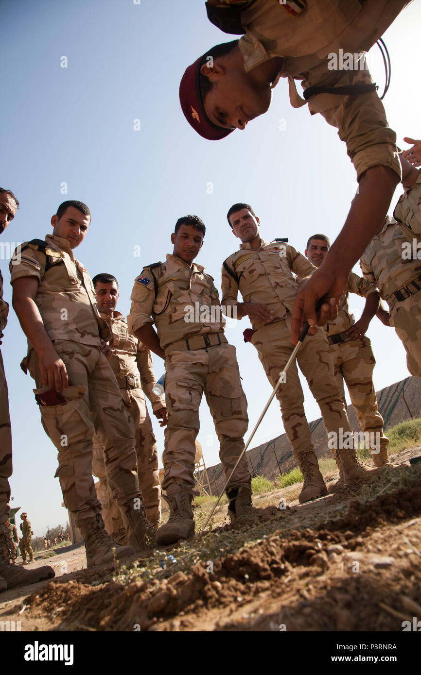 An Iraqi commander discusses the plan of action for searching an area ...