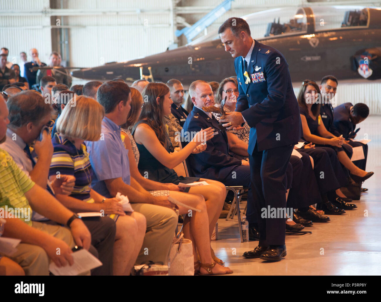 Col. Paul Johnson, the 71st Operations Group commander, presents an ...
