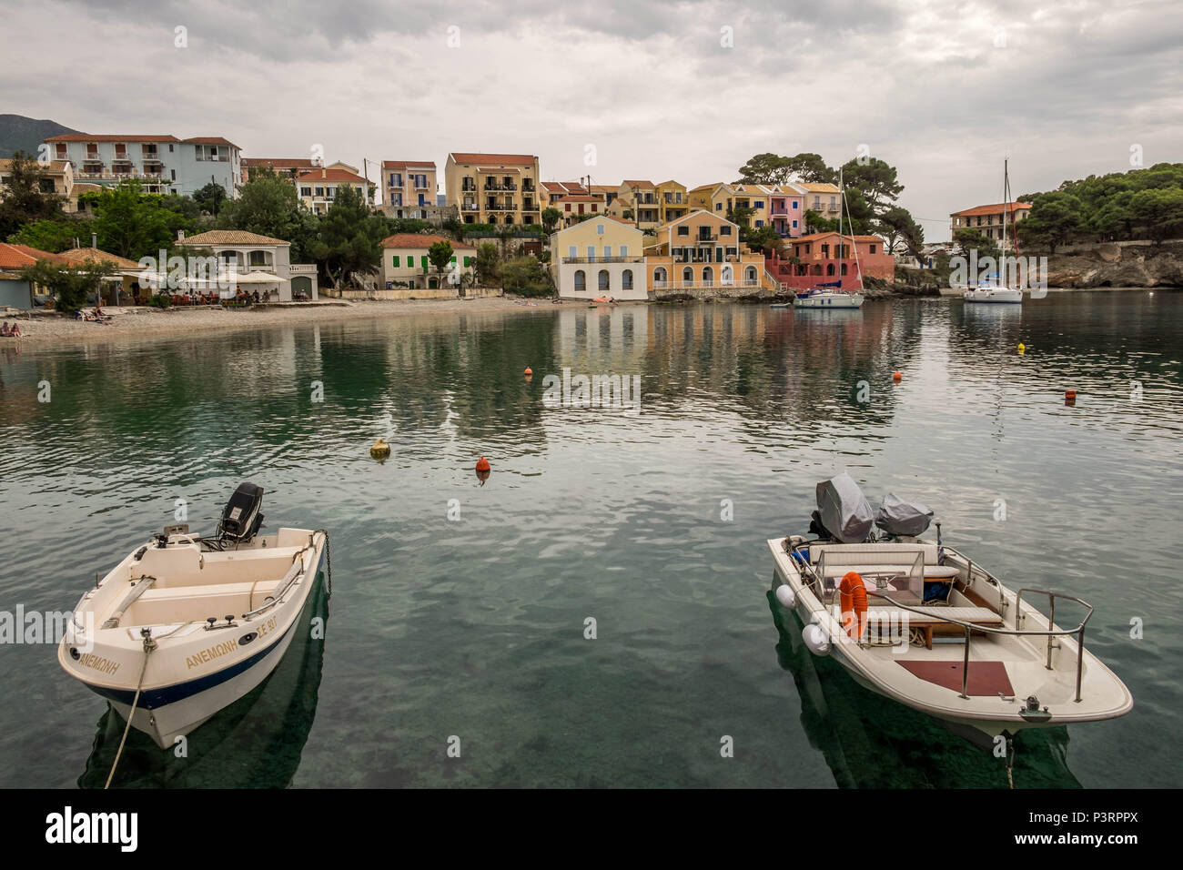Assos beach showing small boats and crane for lifting boats out of the ...