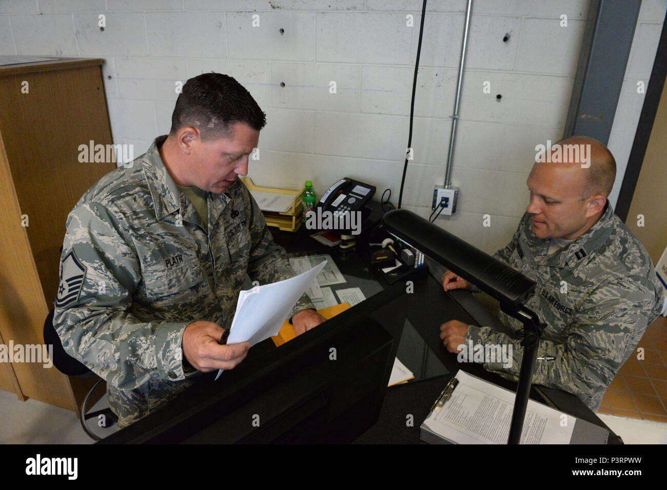 Capt. Shaun Carlson, the 119th Services Flight commander, right ...