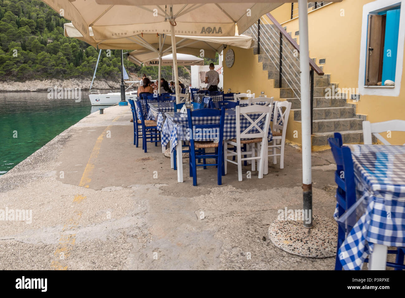 Small outdoor cafe/bar alongside the sea Stock Photo - Alamy