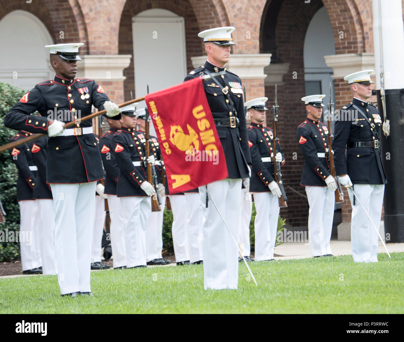 U.S. Marines render honors during a Naming Ceremony for a U.S. Navy ...