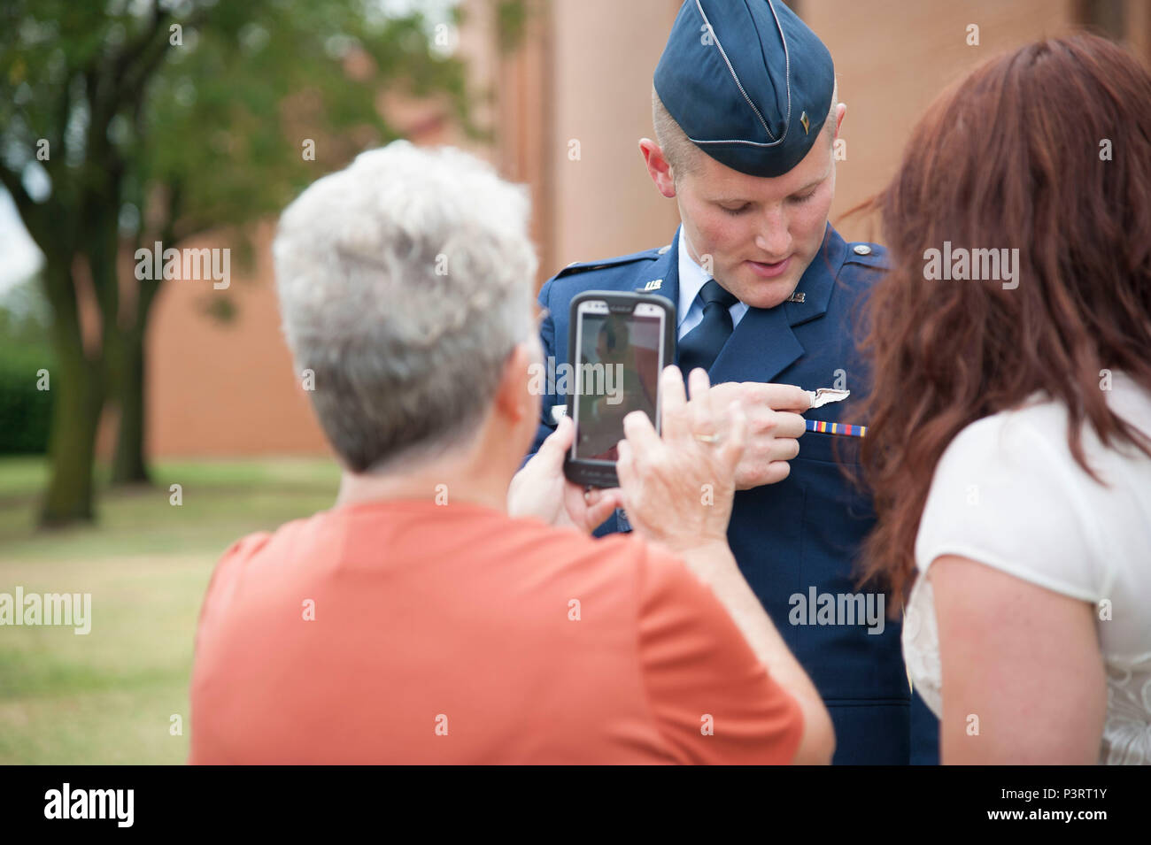 2nd Lt. Samuel Felts, a graduate from class 16-12, straightens his ...