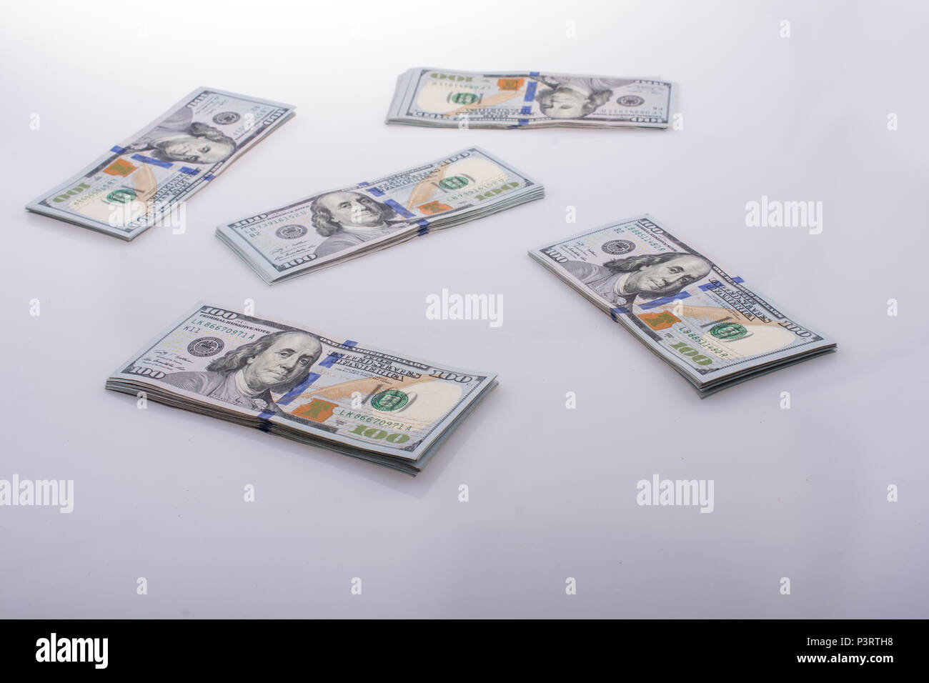 American 100 dollar banknote bundles placed on white background Stock ...