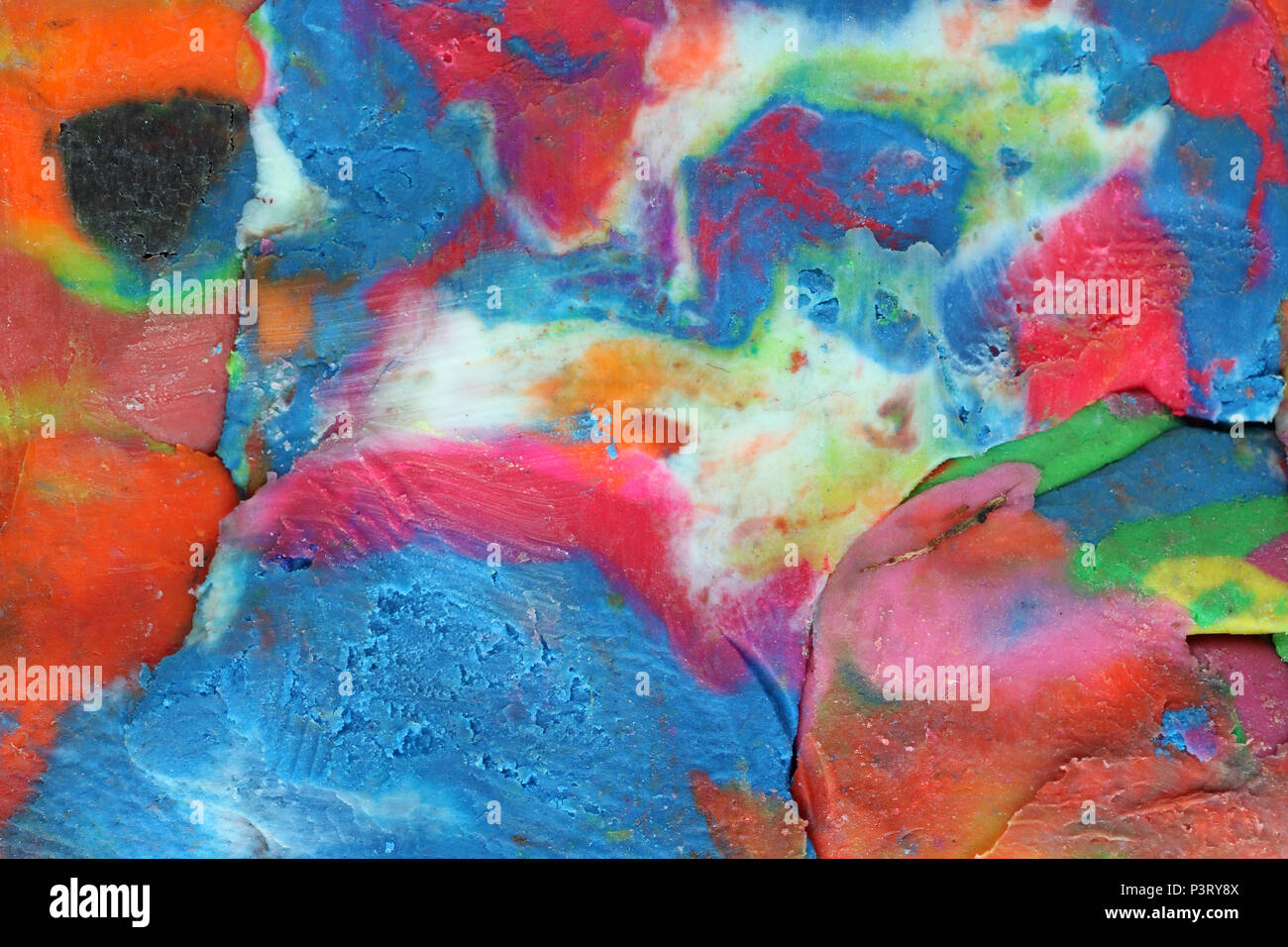 Abstract spots are formed by mixing kids plasticine of different colors ...