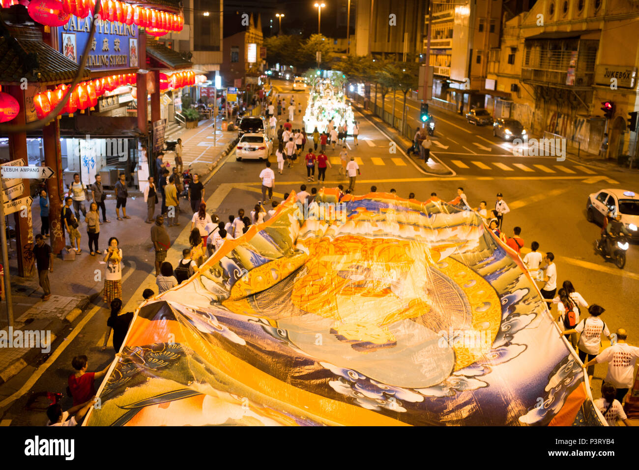 A giant buddhish flag carried by pilgrims marching at chinatown, Kuala ...