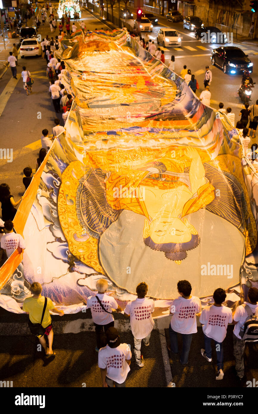 A giant buddhish flag carried by pilgrims marching at chinatown, Kuala ...