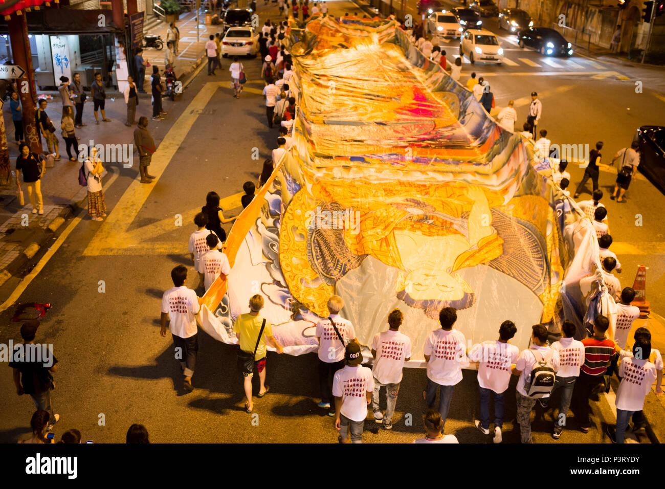 A giant buddhish flag carried by pilgrims marching at chinatown, Kuala ...