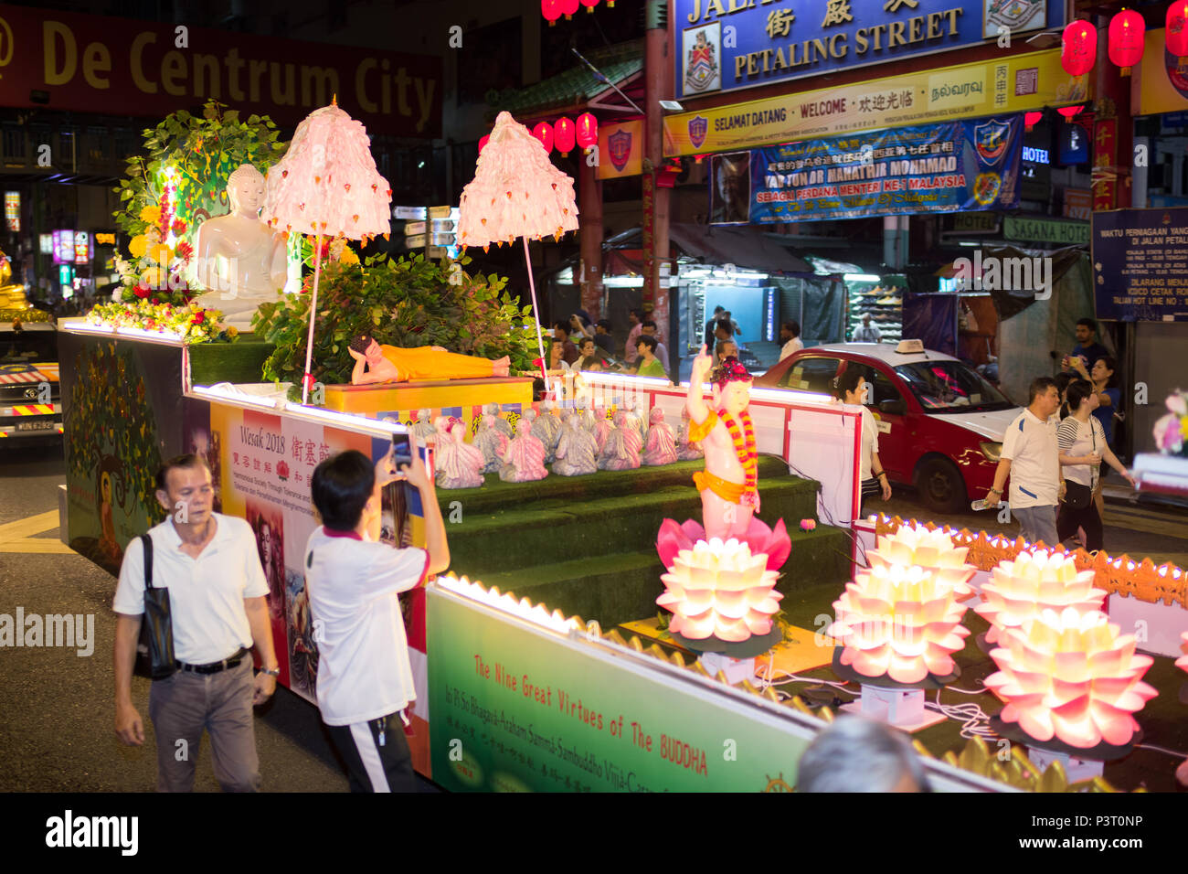 Wesak procession floats vehicles and buddhist pilgrims Passing through ...