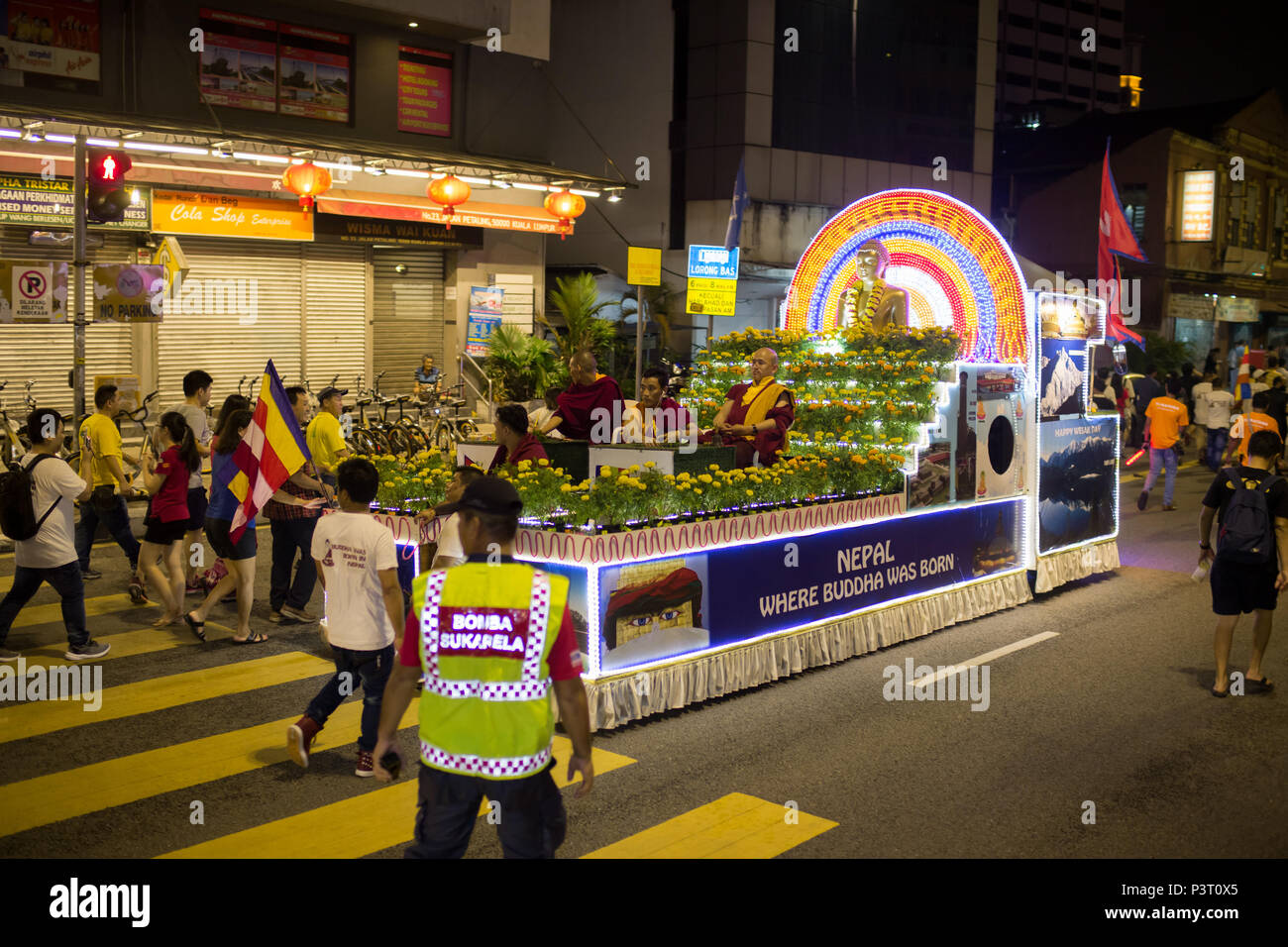 Wesak procession floats vehicles and buddhist pilgrims Passing through ...