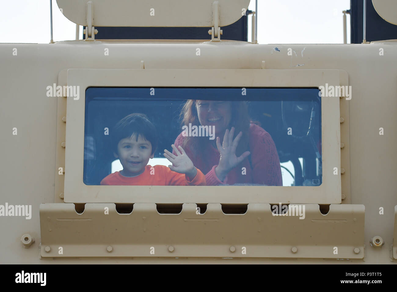 Bonita Buffkin and her son Jordan, 3, wave from inside U.S. Army ...
