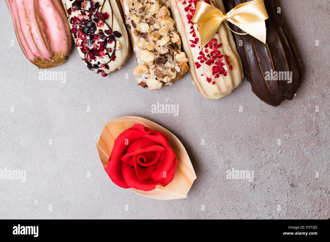 Sweet delicious colorful french eclairs. Group of french dessert with ...