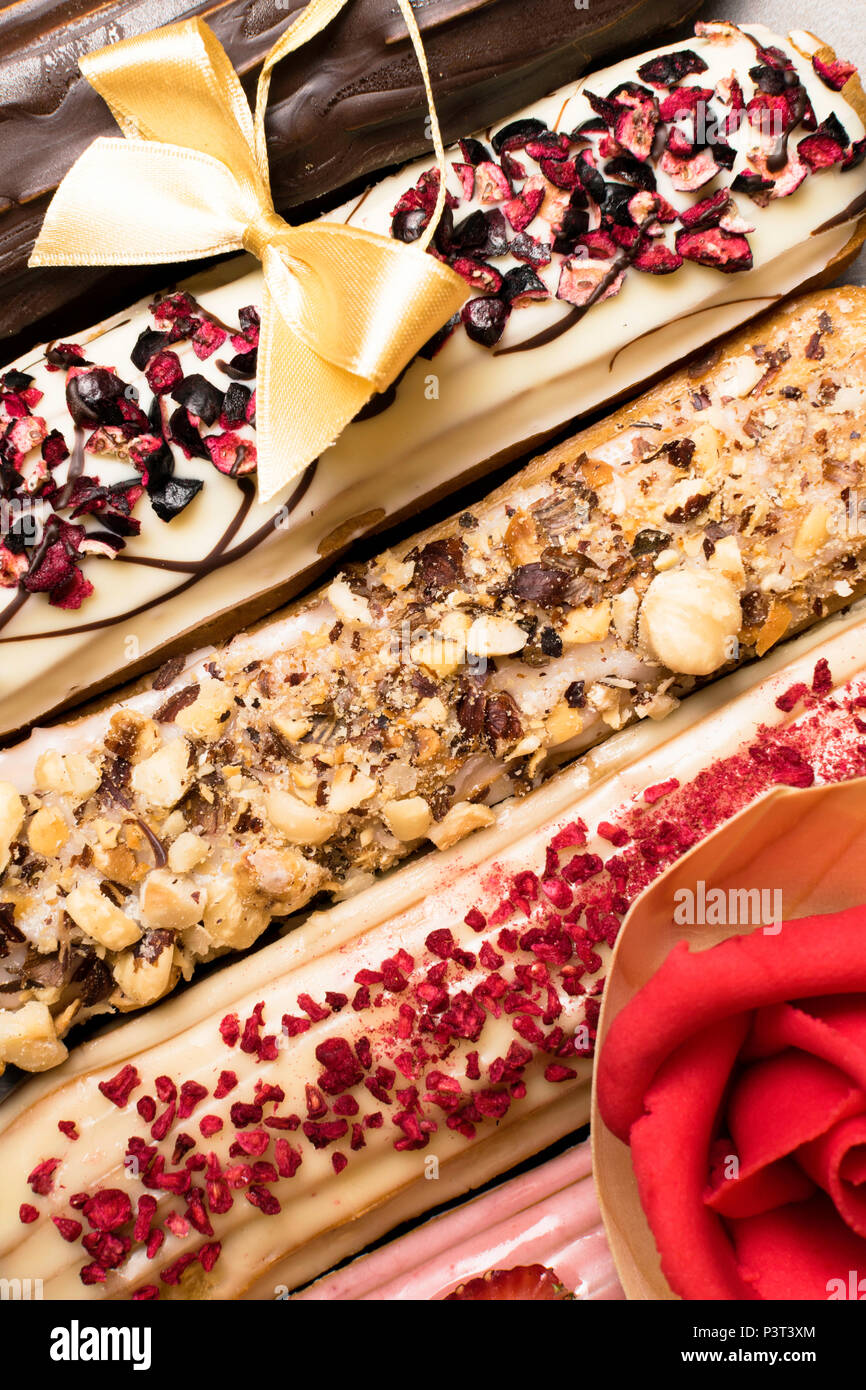 Sweet delicious colorful french eclairs. Group of french dessert ...