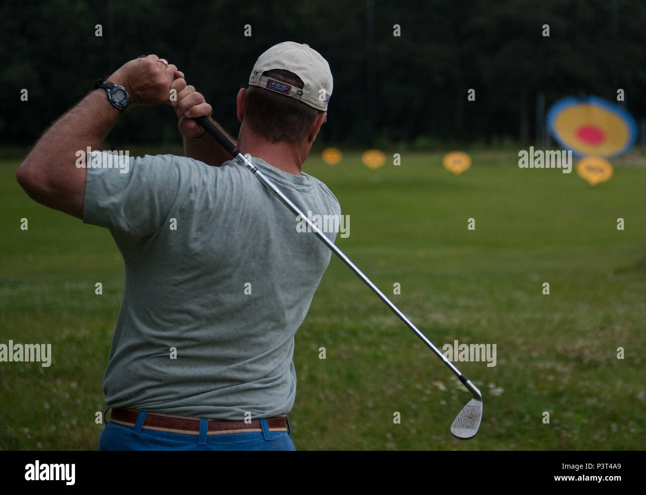 A participant of a Woodlawn Golf Course class follows the trajectory of ...