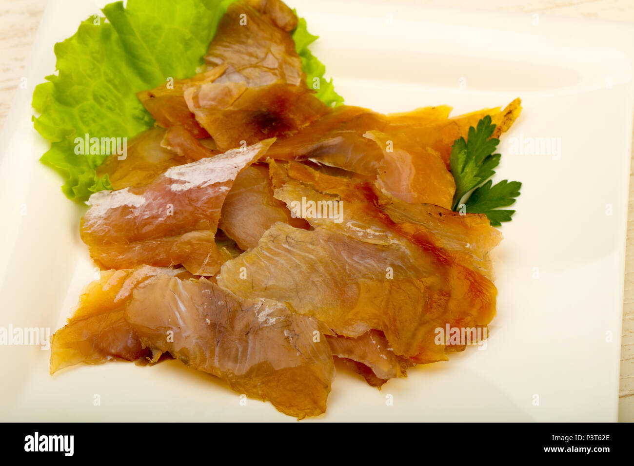 Smoked catfish fillet carpaccio Stock Photo - Alamy