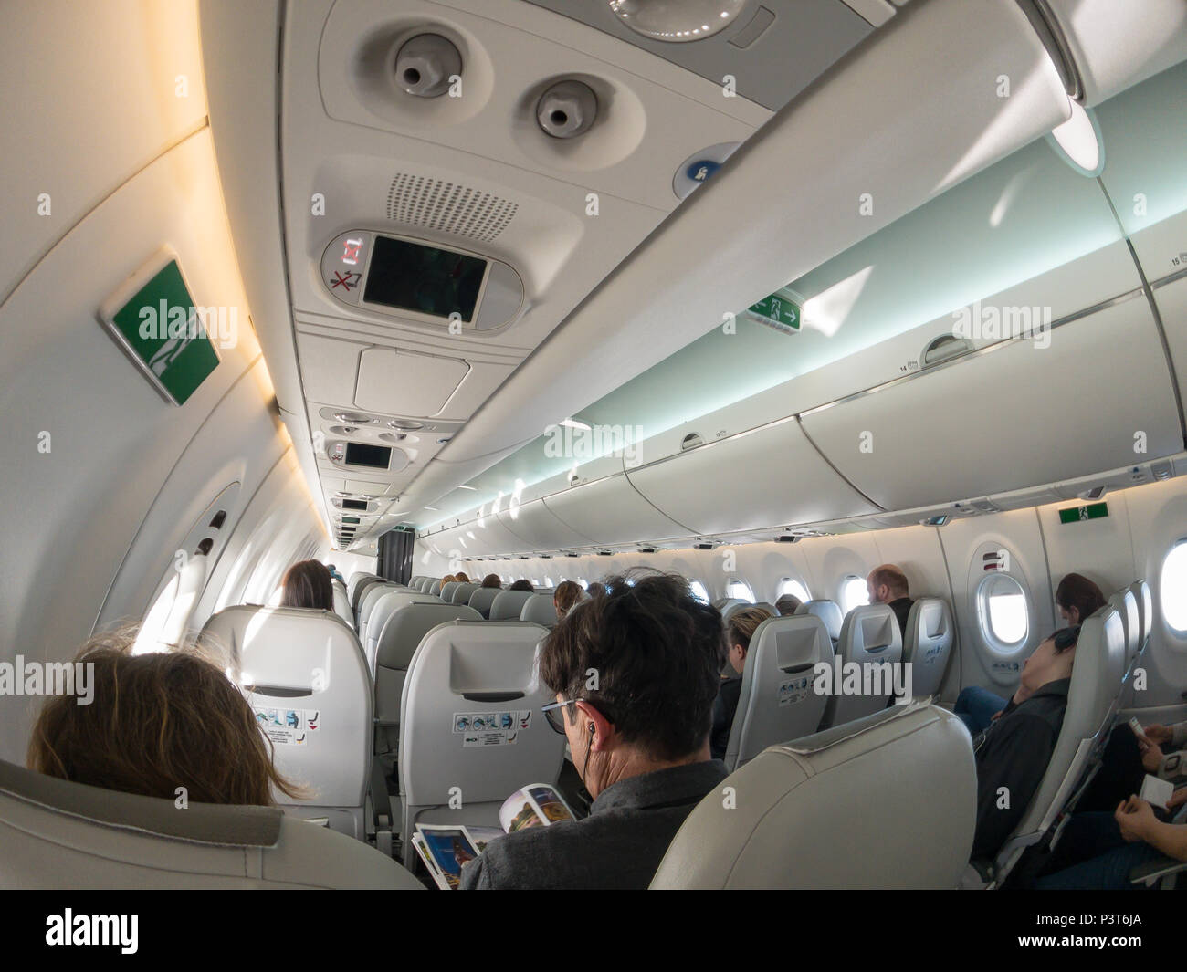 Passengers at the economy class Stock Photo - Alamy
