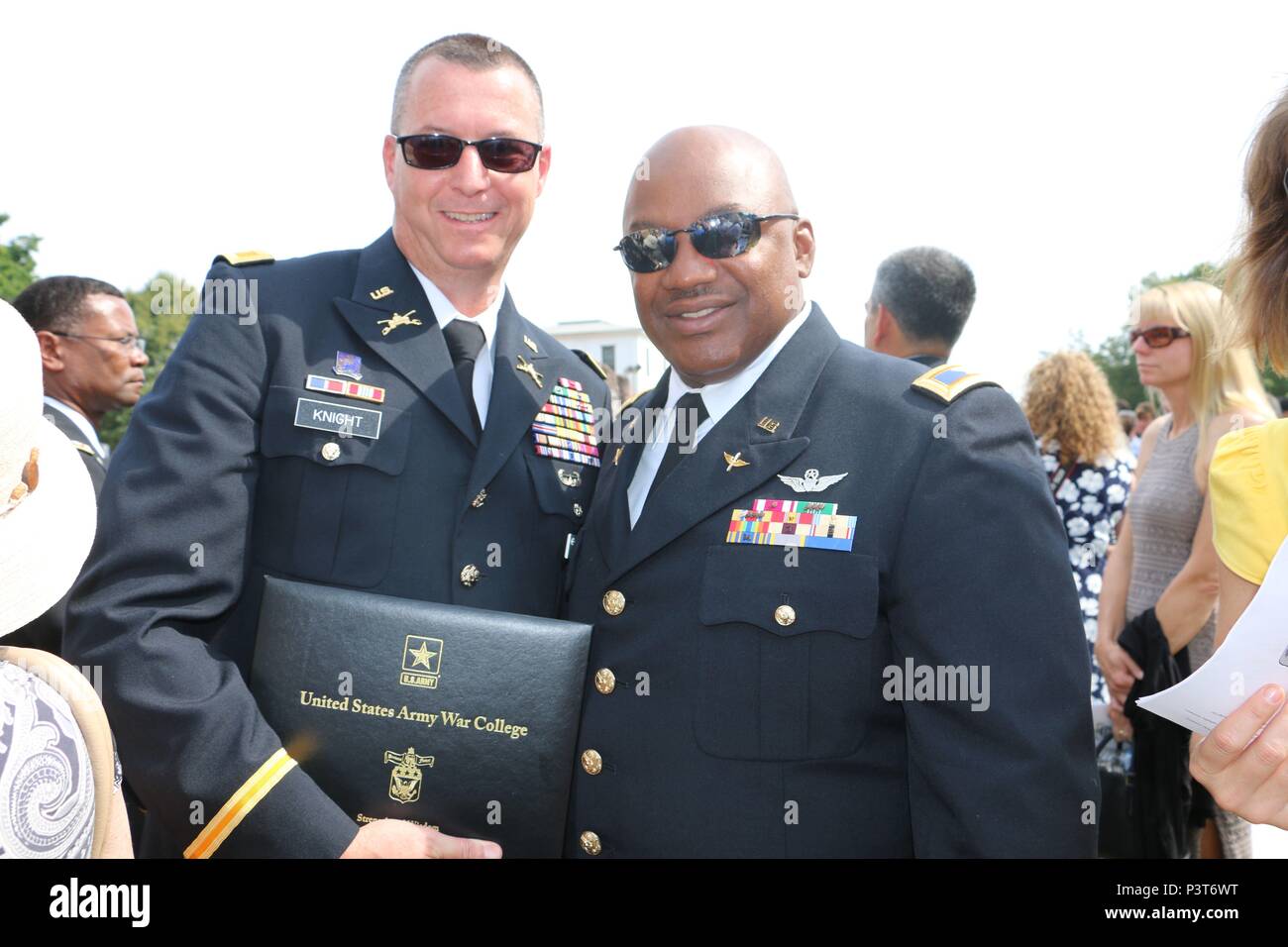 Col. Brad Knight is congratulated by Army War College graduate and ...