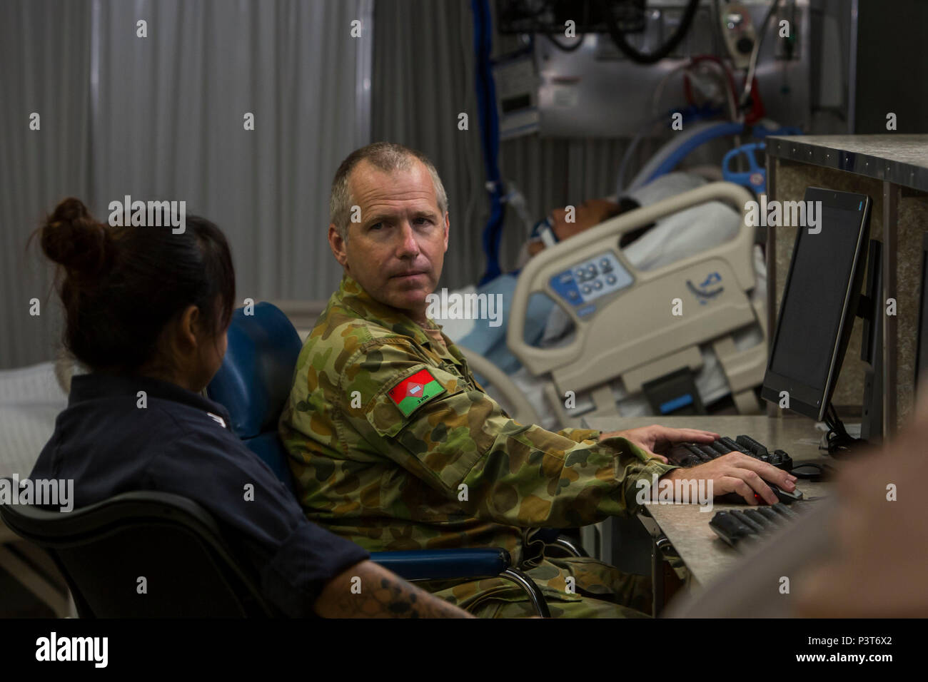 An Australian Army Reserve nursing officer collaborates with a U.S ...