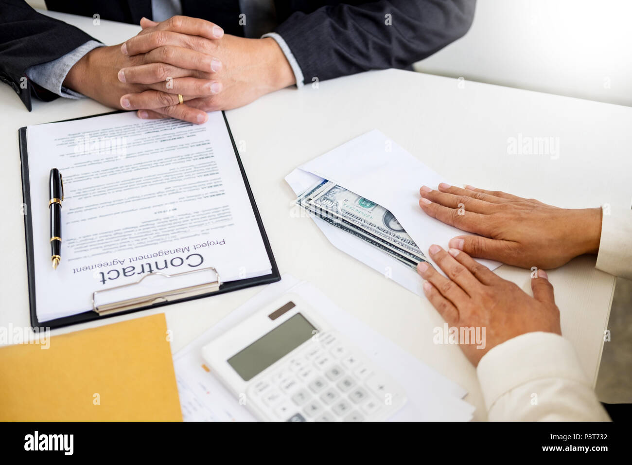 Corrupted businessman, or politician bribe in the form of hundred ...