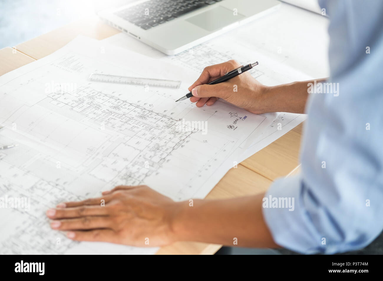 Person's engineer Hand Drawing Plan On Blue Print with architect ...