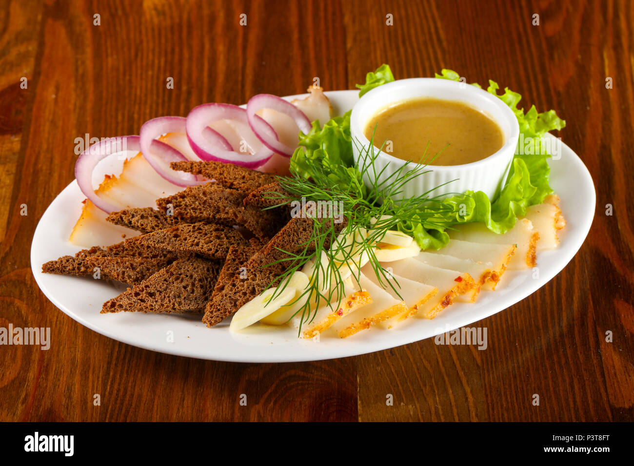 Pork fat snack with bread and mustard sauce Stock Photo - Alamy