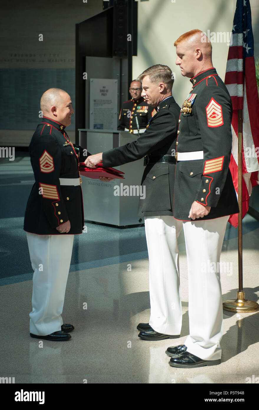 U.S. Marine Corps Gunnery Sgt. David E. Ramirez receives a letter of appriciation from the ...