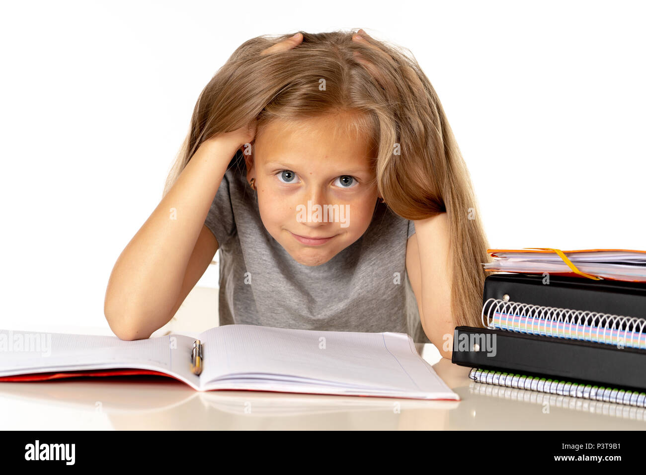 sweet young little schoolgirl pulling her hair desperate in stress ...